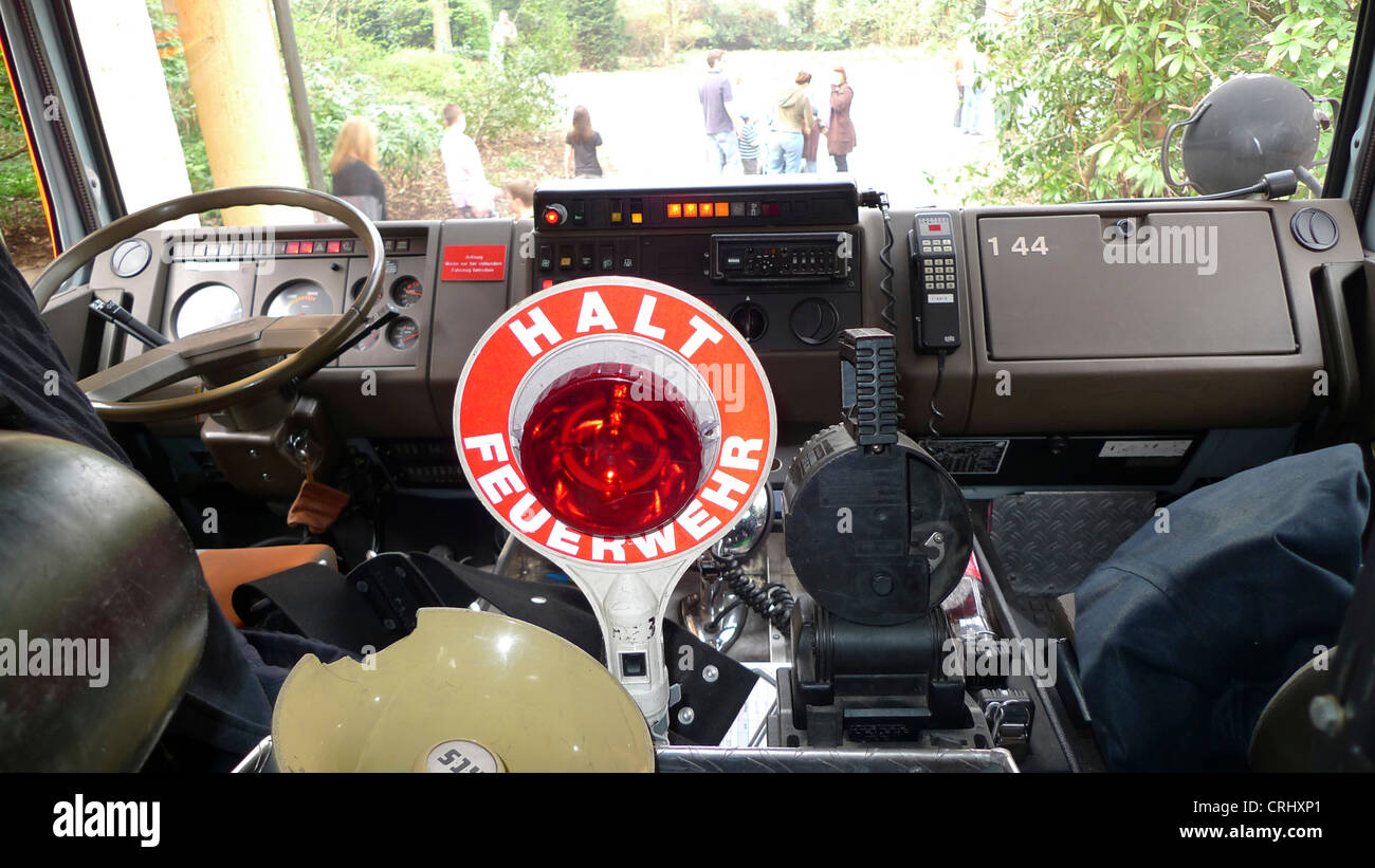 in the cockpit of a fire engine with Traffic paddle, Germany Stock ...