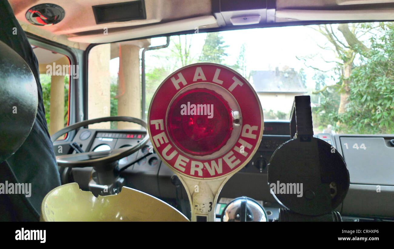 in the cockpit of a fire engine with Traffic paddle, Germany Stock ...