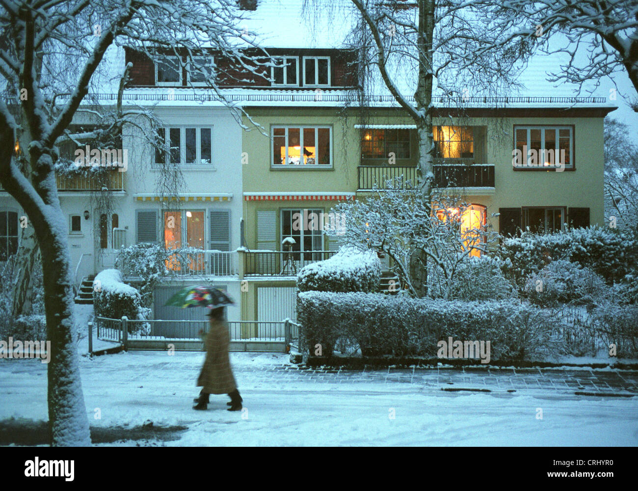 Lighted windows of some houses in winter Stock Photo - Alamy