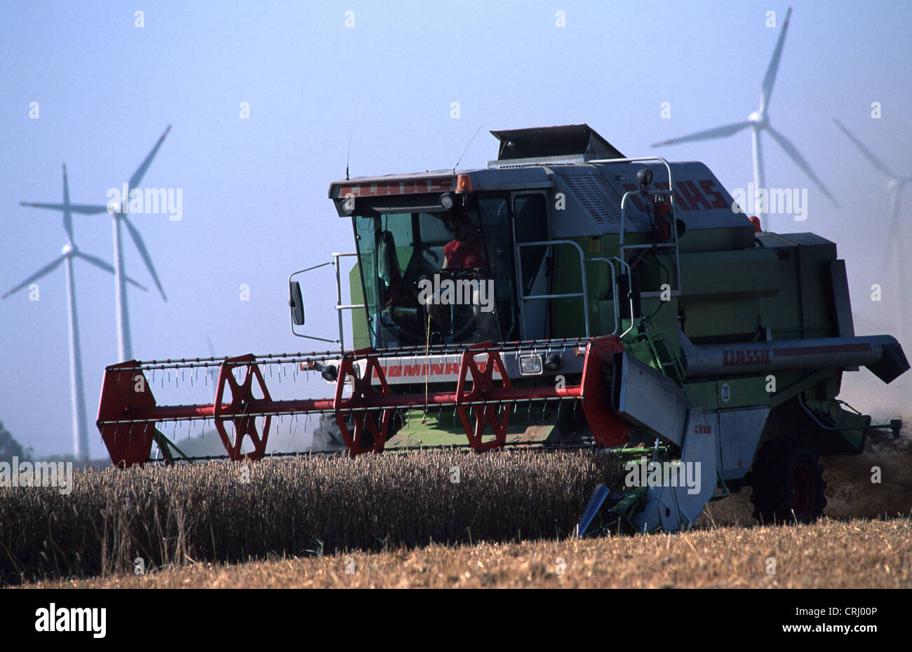 Harvesting combine harvester wind hi-res stock photography and images ...