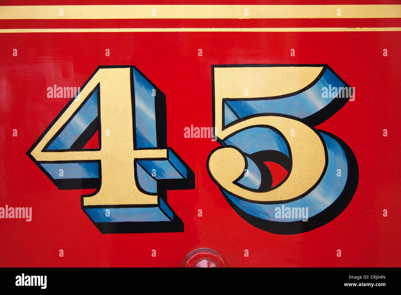 Gold number 45 on red background Stock Photo - Alamy