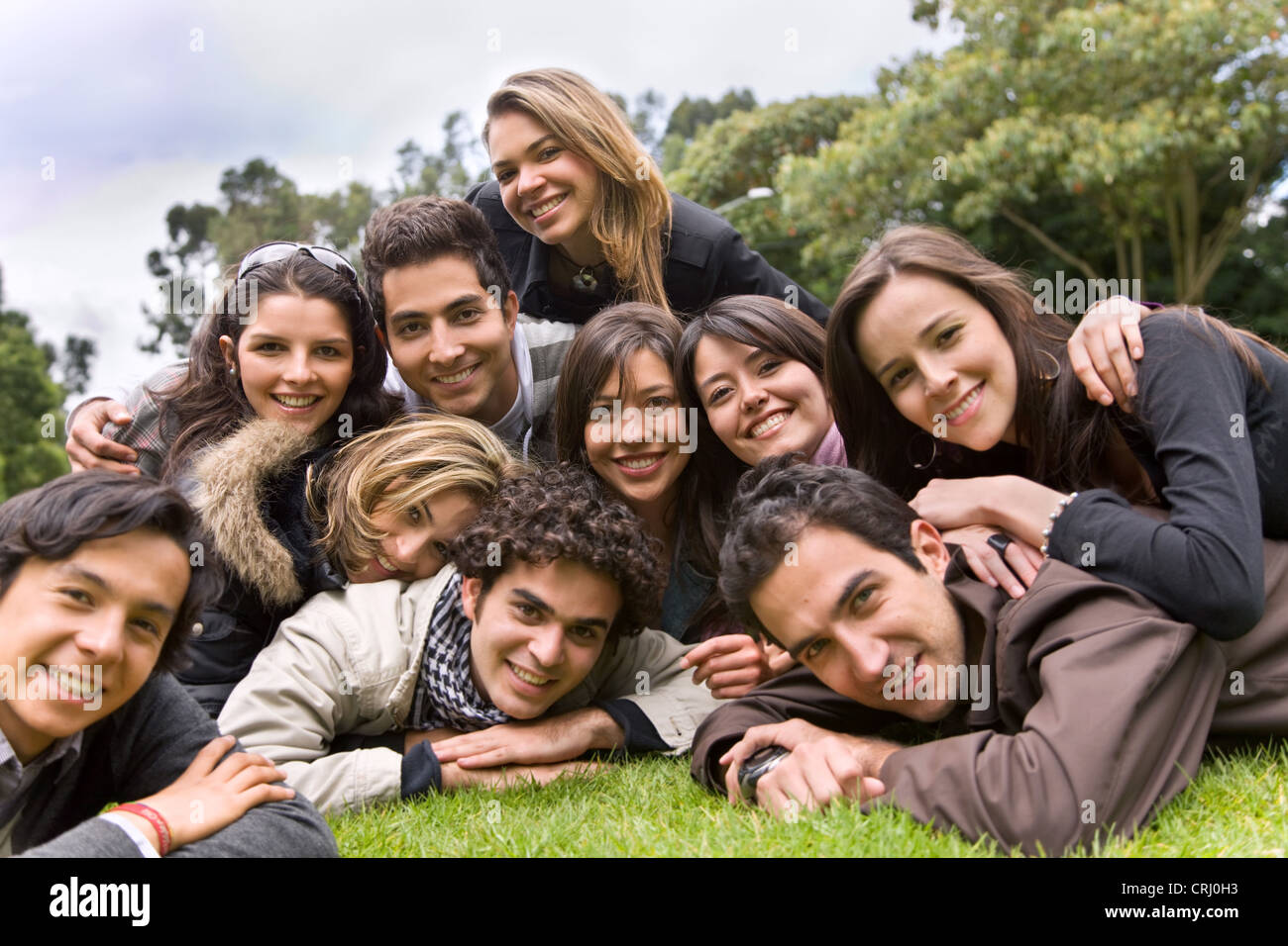 happy group of friends smiling outdoors in a park Stock Photo - Alamy