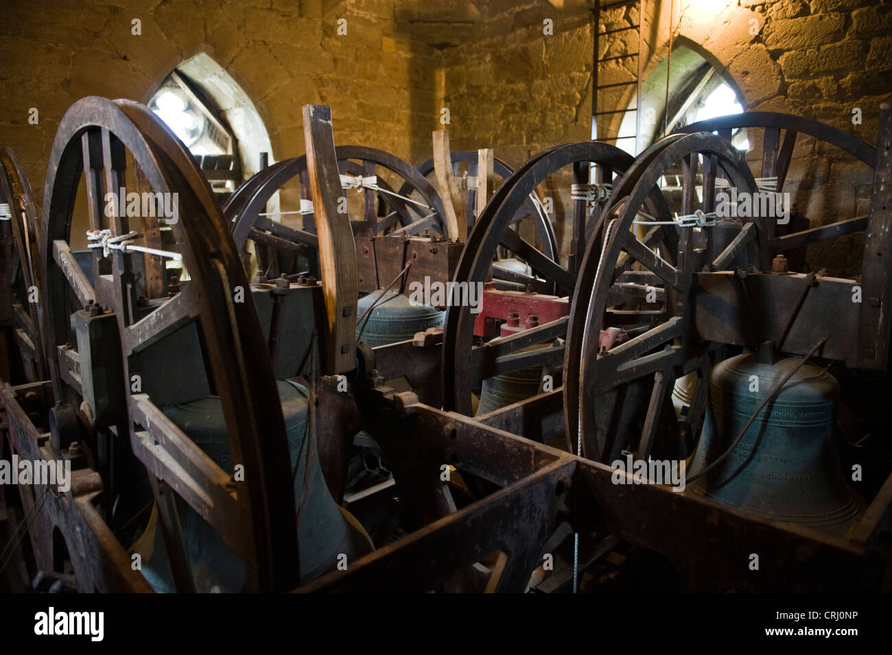 Church bells mounted on frame in bell chamber in tower of St Andrew's ...