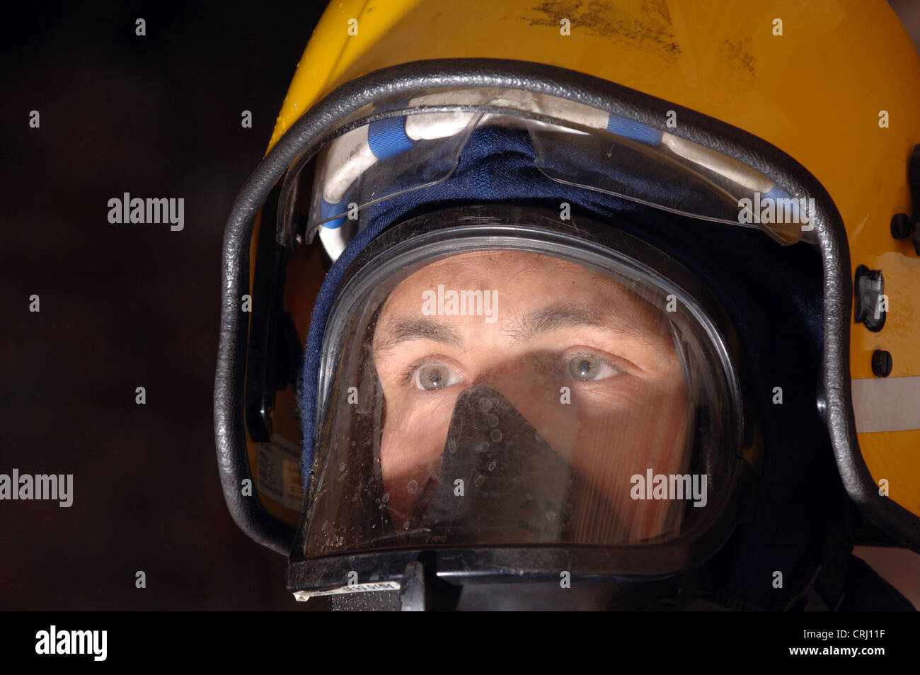 fire fighter in his helmet and mask Stock Photo - Alamy