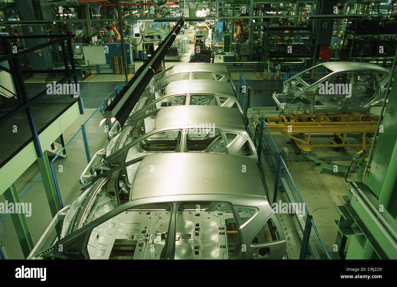 Car bodies on an assembly line Stock Photo - Alamy