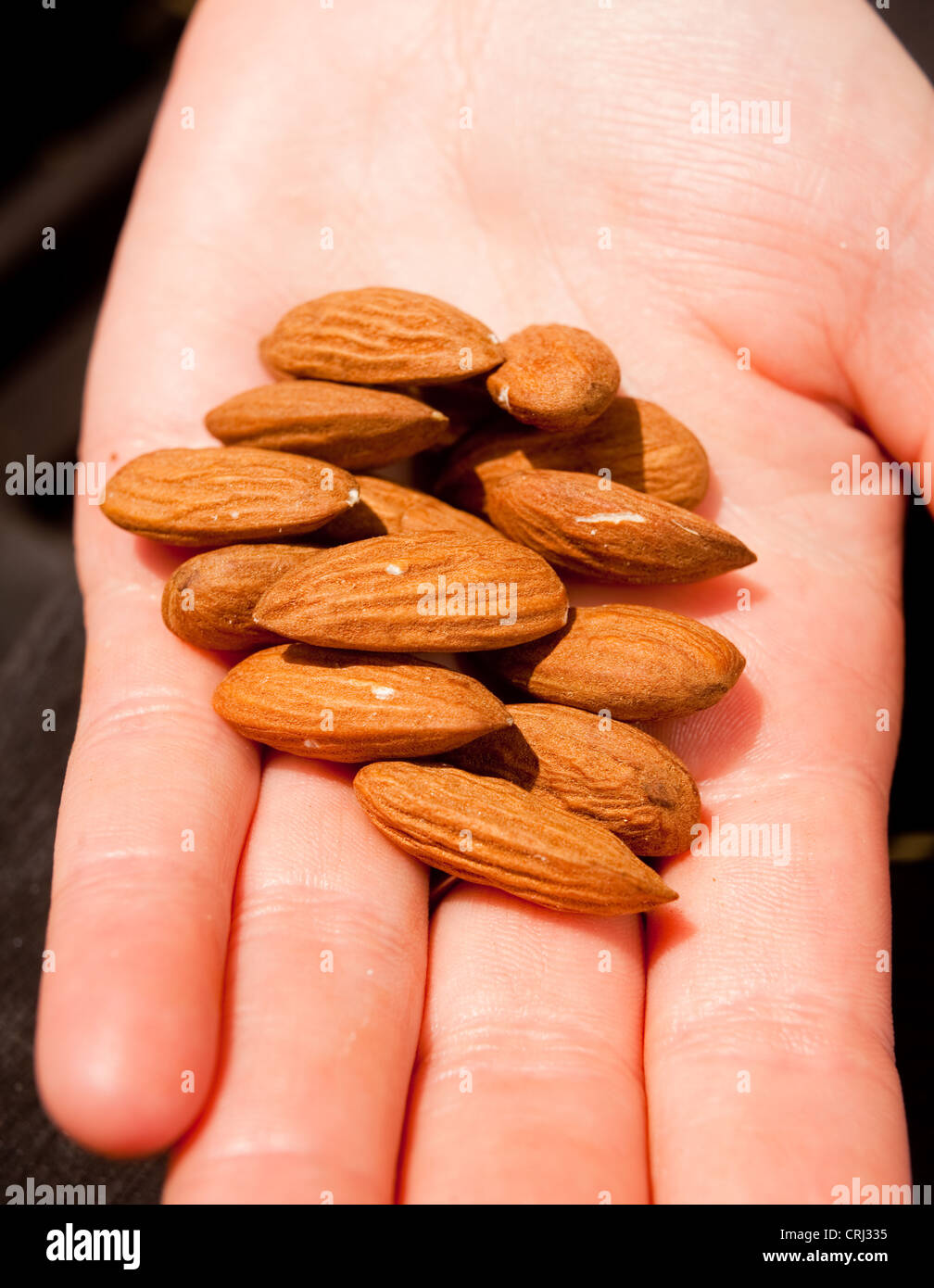Handful of almond nuts full of protein and part of a healthy diet Stock ...