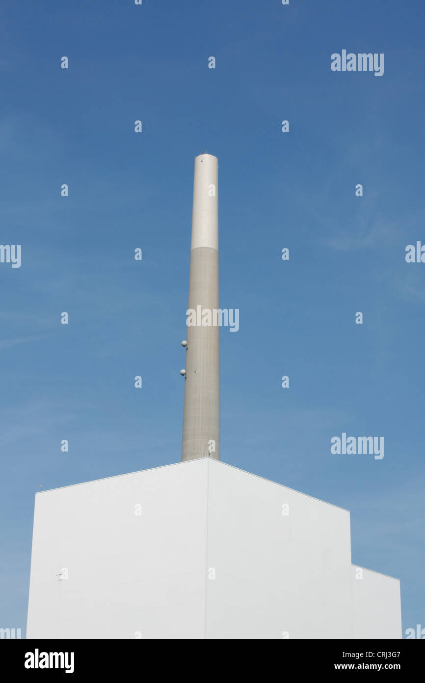 A factory with a tall chimney Stock Photo - Alamy