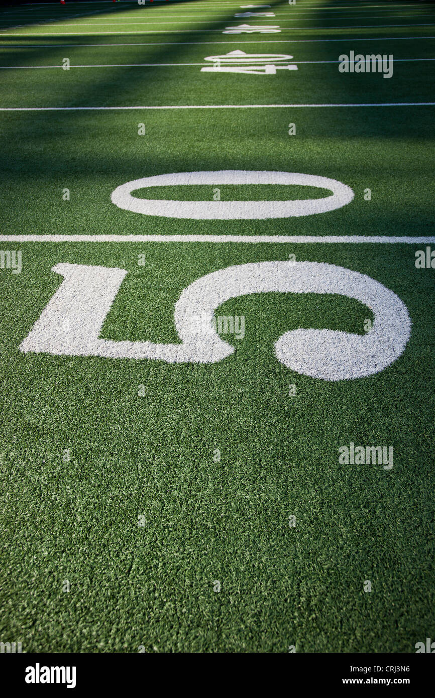 50 yard line marker in American Football stadium Stock Photo - Alamy