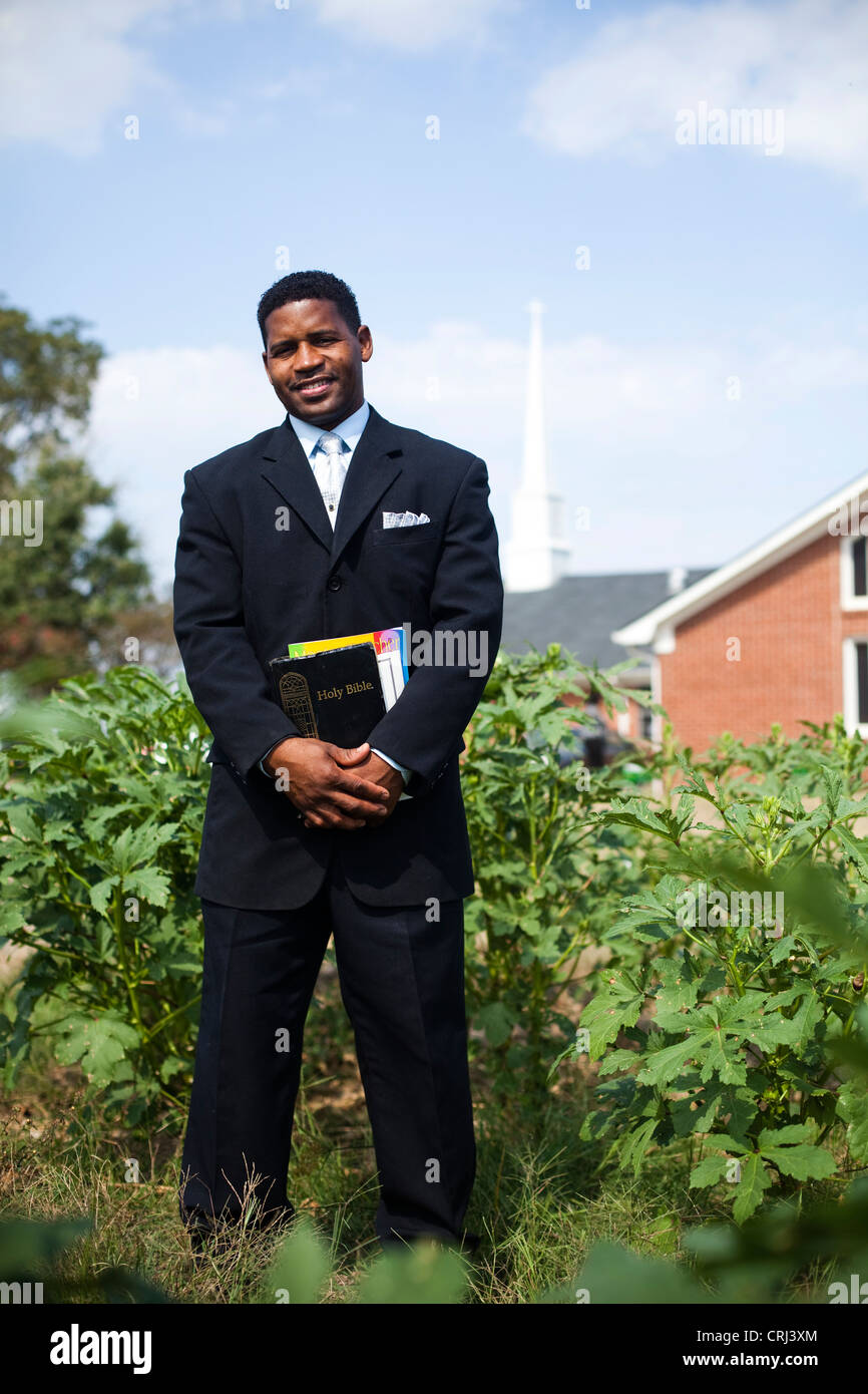 Smiling preacher bible in church hi-res stock photography and images ...