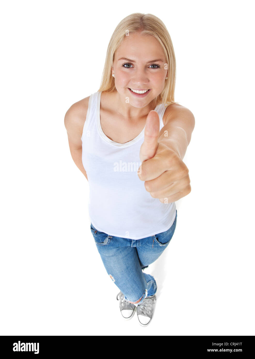 Full length shot of an attractive teenage girl showing thumbs up. High ...