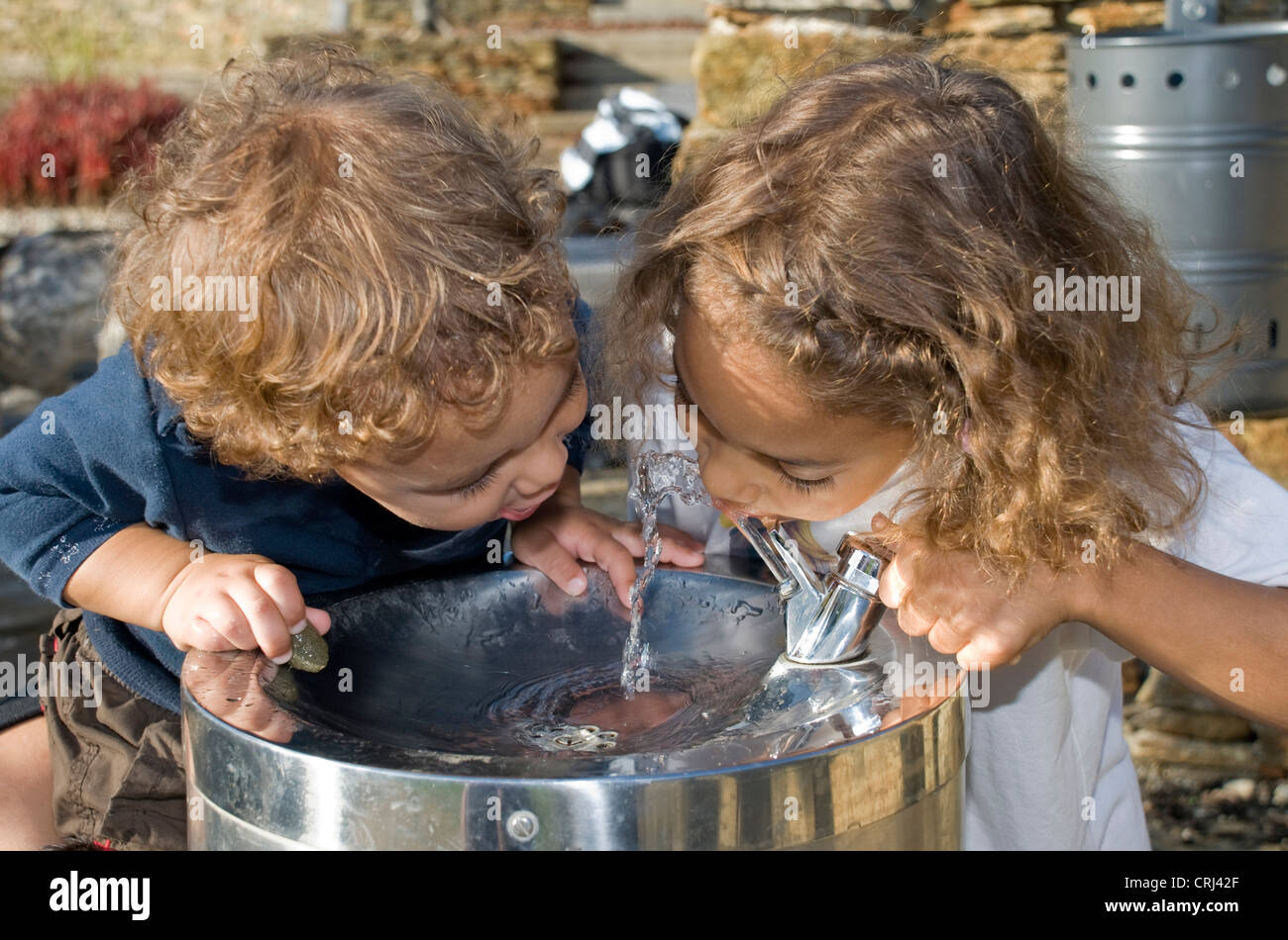 children drink water from water tap Stock Photo - Alamy