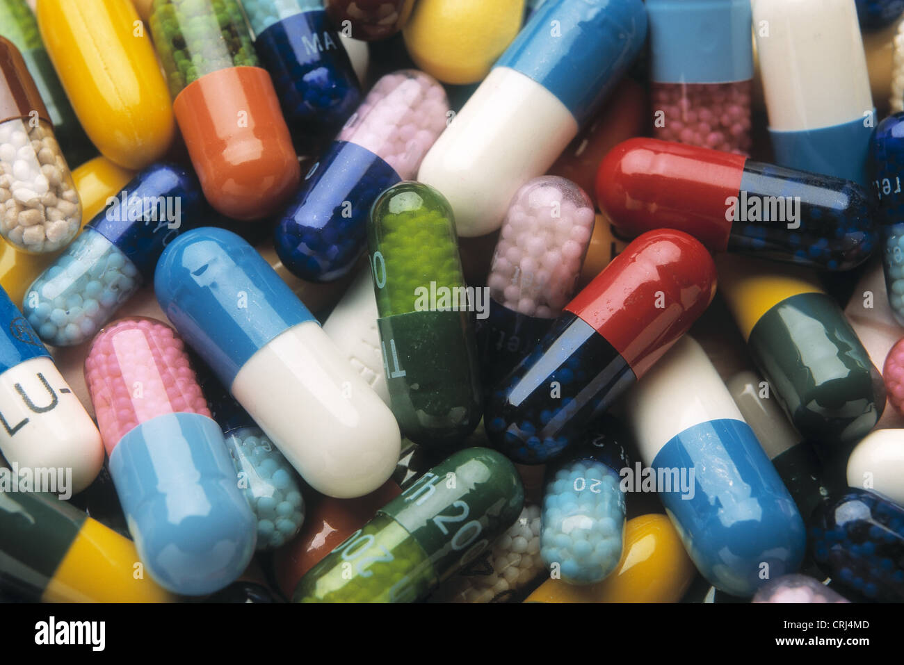 Drug capsules in different shapes and colors as Macro Stock Photo - Alamy