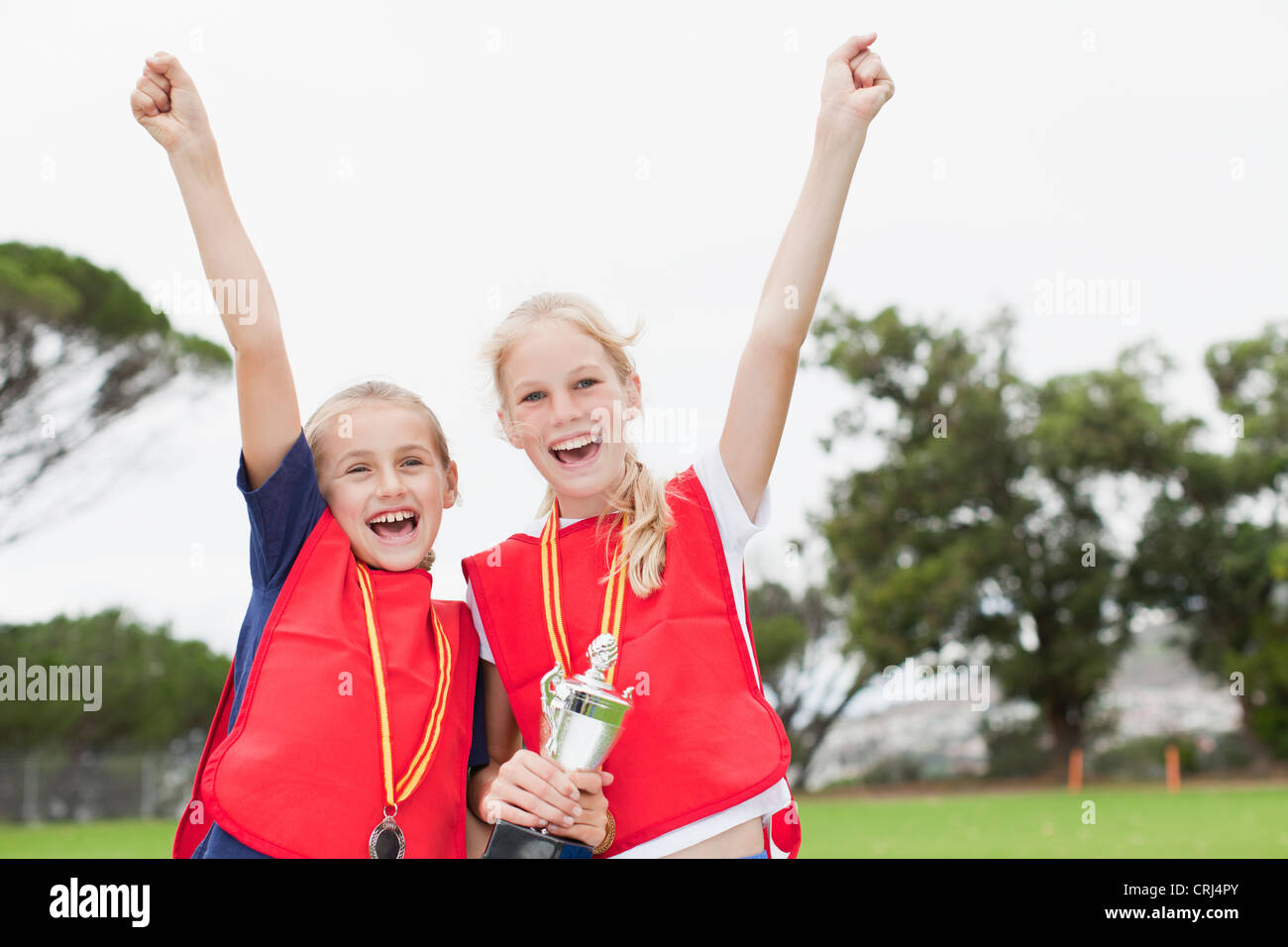 Children cheering with medal Stock Photo - Alamy