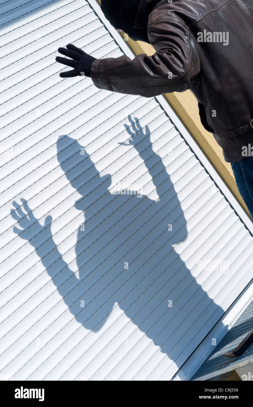 housebreaker caught red-handed holding the hands up Stock Photo - Alamy