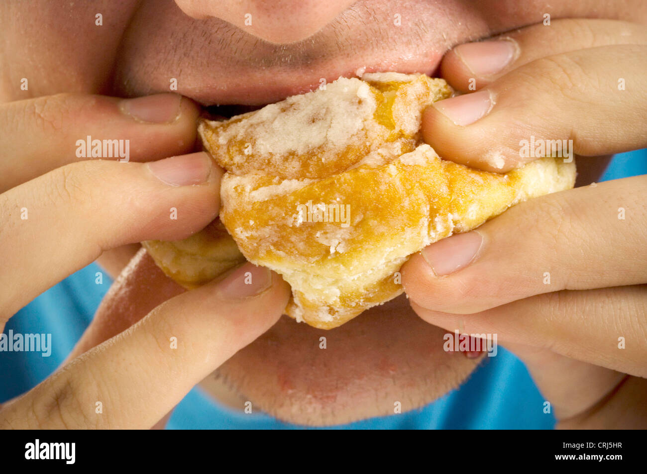 A young male jam donut junkie. Jam donuts have been criticized by junk ...