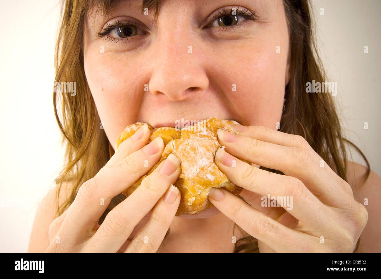 A young female jam donut junkie. Jam donuts have been criticized by ...