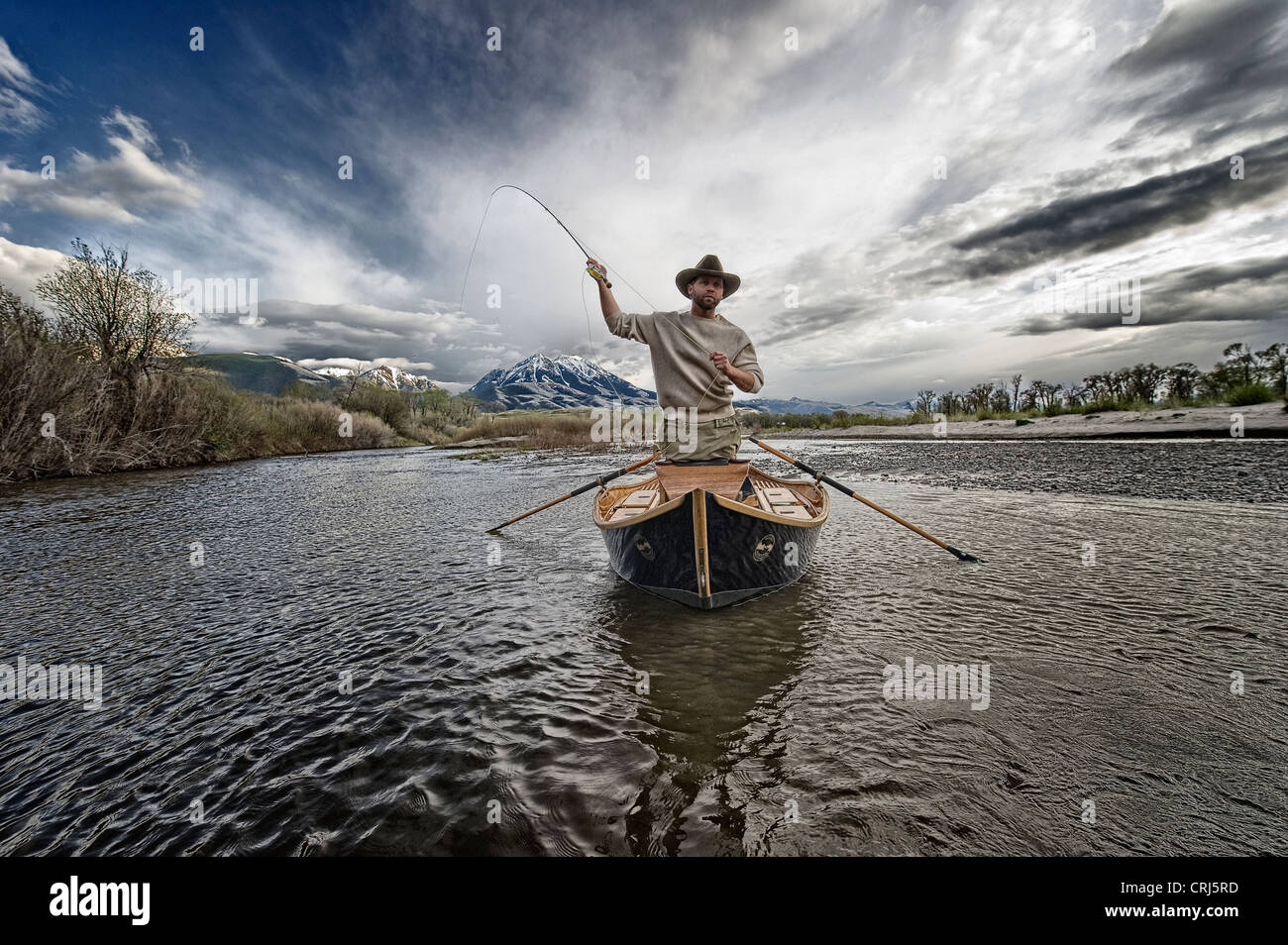 Fly fishing from boat Stock Photo - Alamy