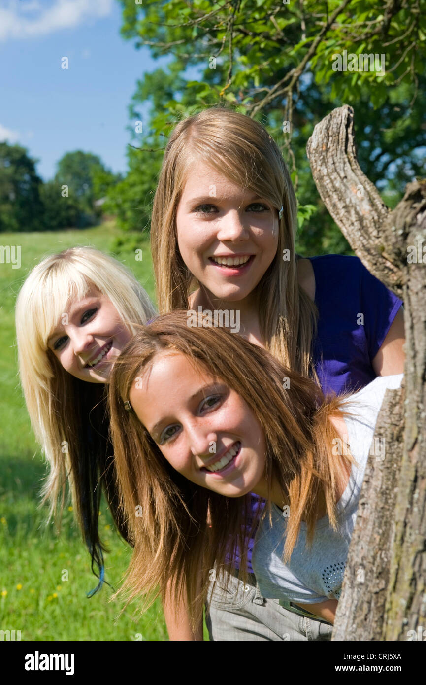 Kids girls behind plants hi-res stock photography and images - Alamy
