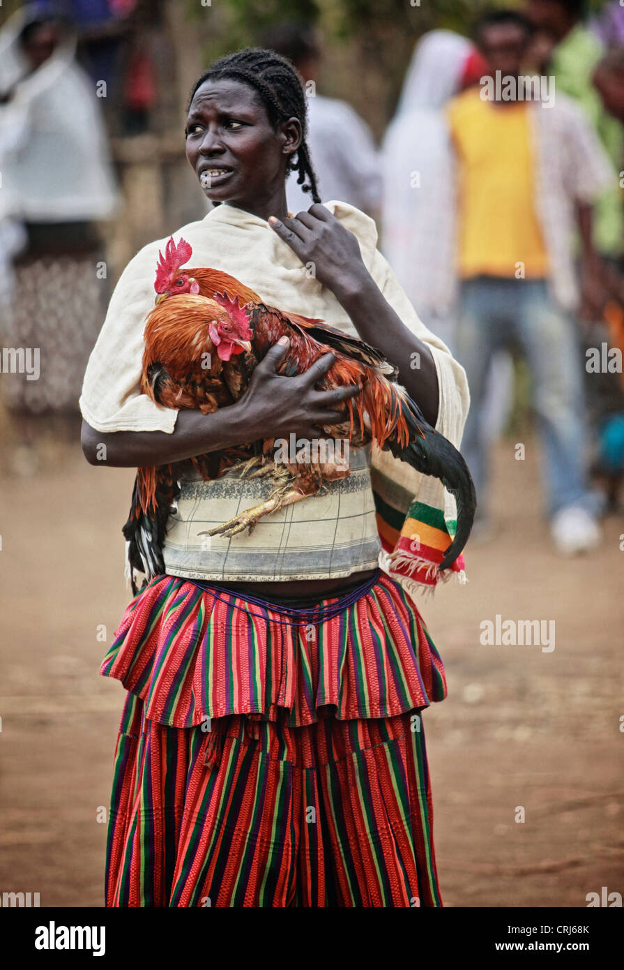 Woman with two roosters hi-res stock photography and images - Alamy