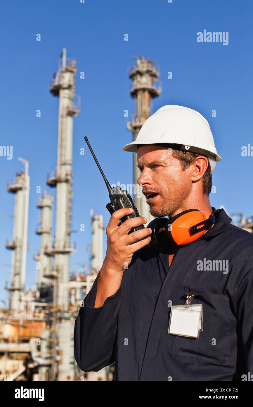 Worker using walkie talkie on site Stock Photo - Alamy