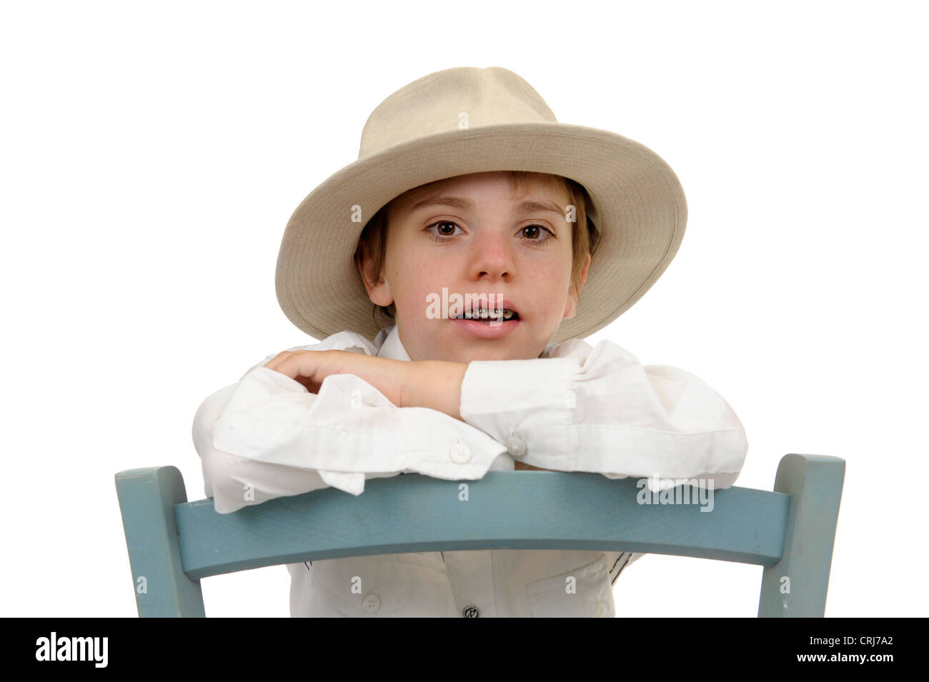 boy sitting on a chair Stock Photo - Alamy