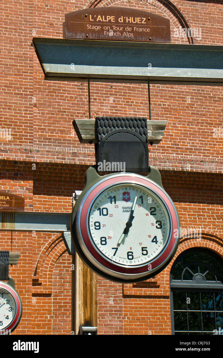 Large hanging clock showing times in various parts of the world Stock ...
