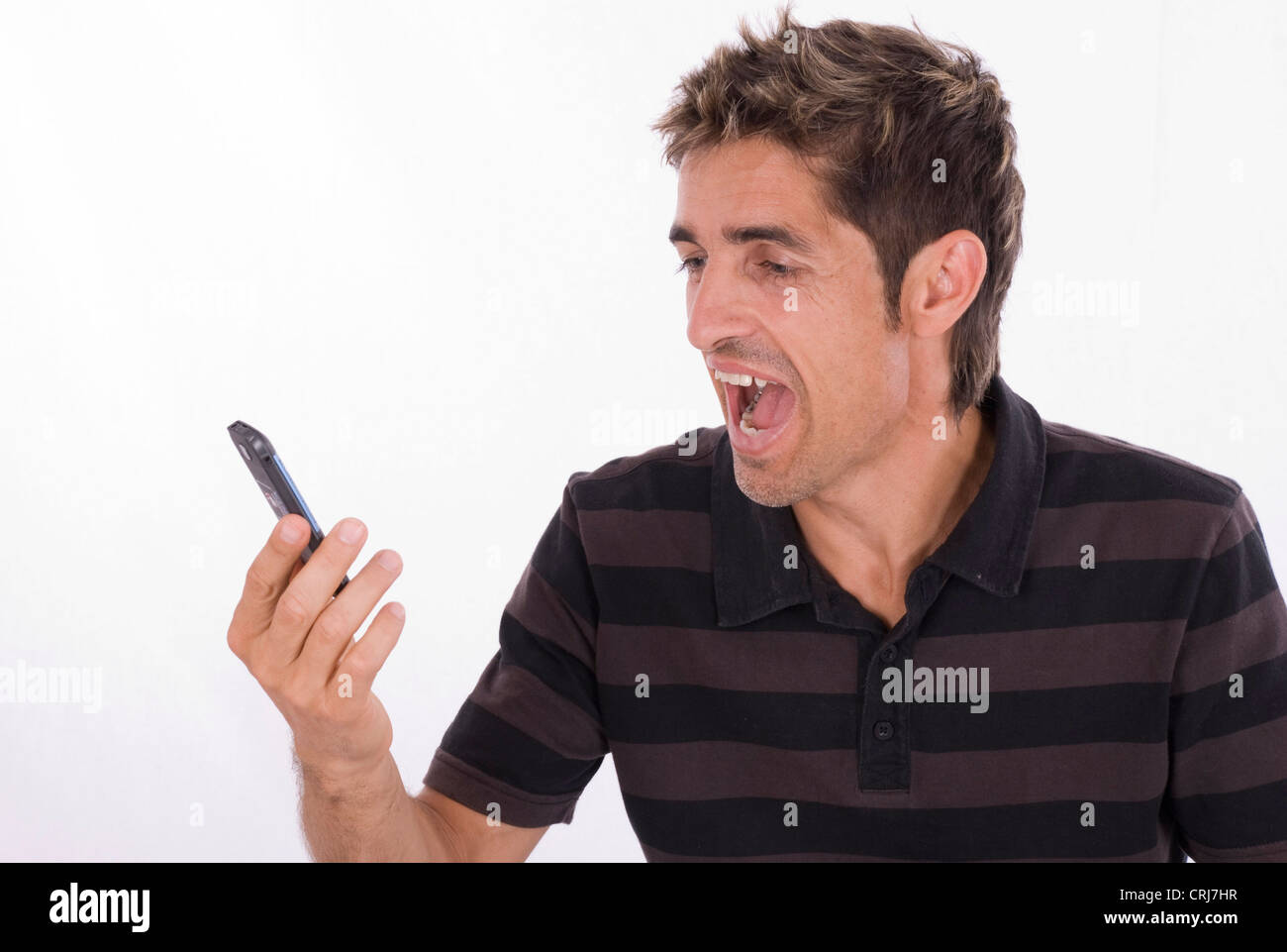 man screaming at his mobile phone Stock Photo - Alamy