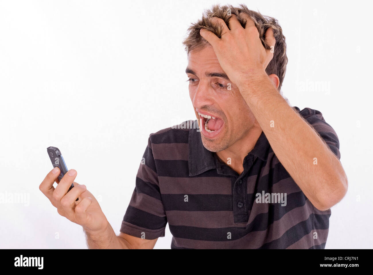 Old man yelling at his cell phone hi-res stock photography and images ...