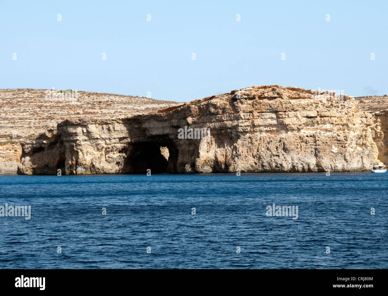 Rocks on blue sea hi-res stock photography and images - Alamy