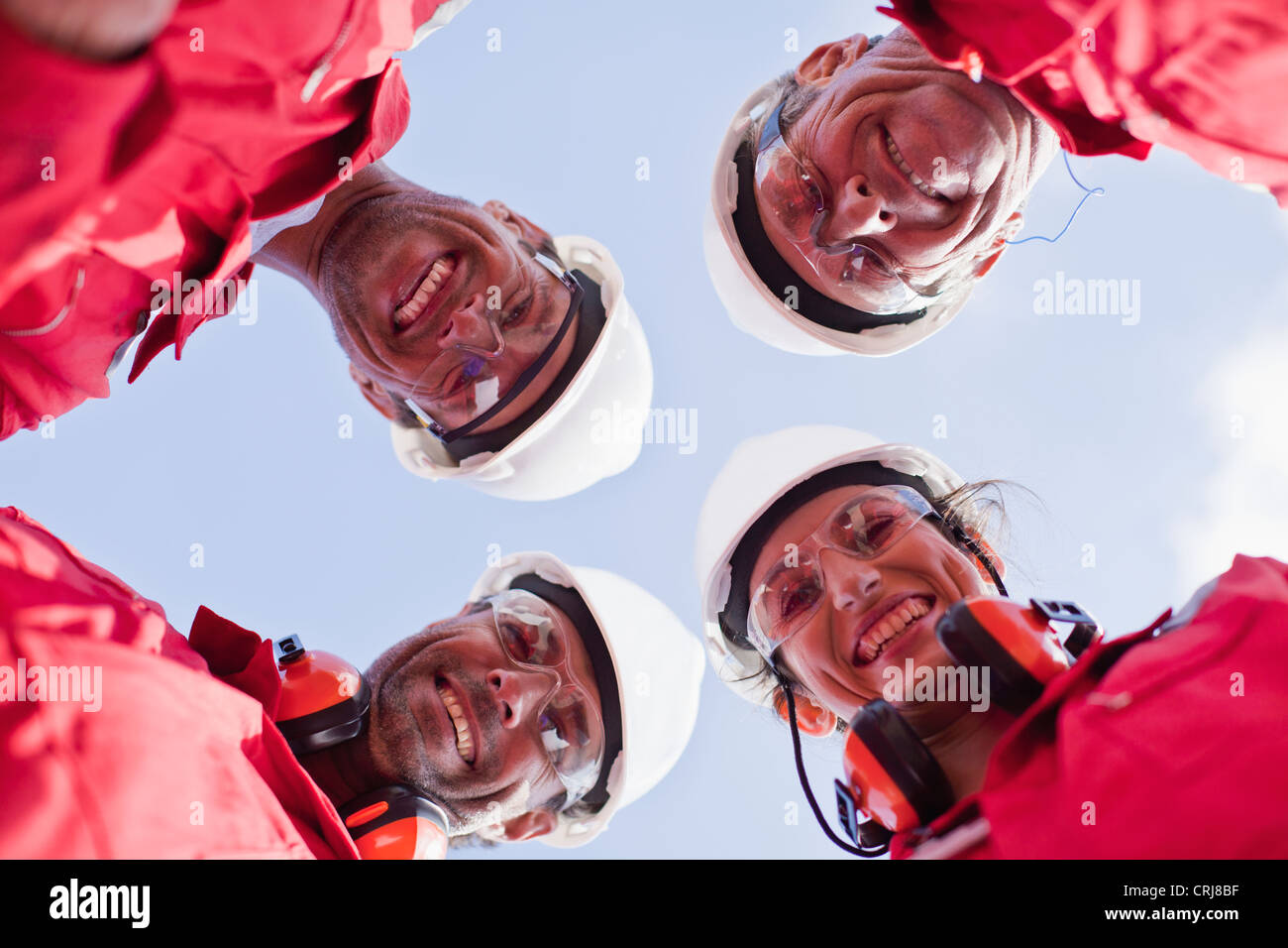 Smiling workers posing outdoors Stock Photo - Alamy