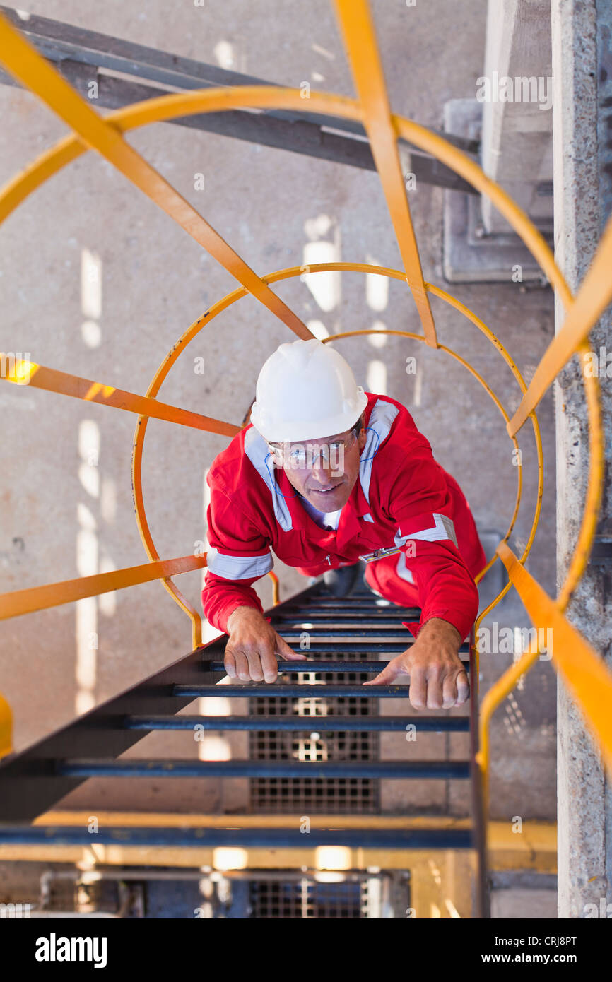 Worker Climbing Ladder