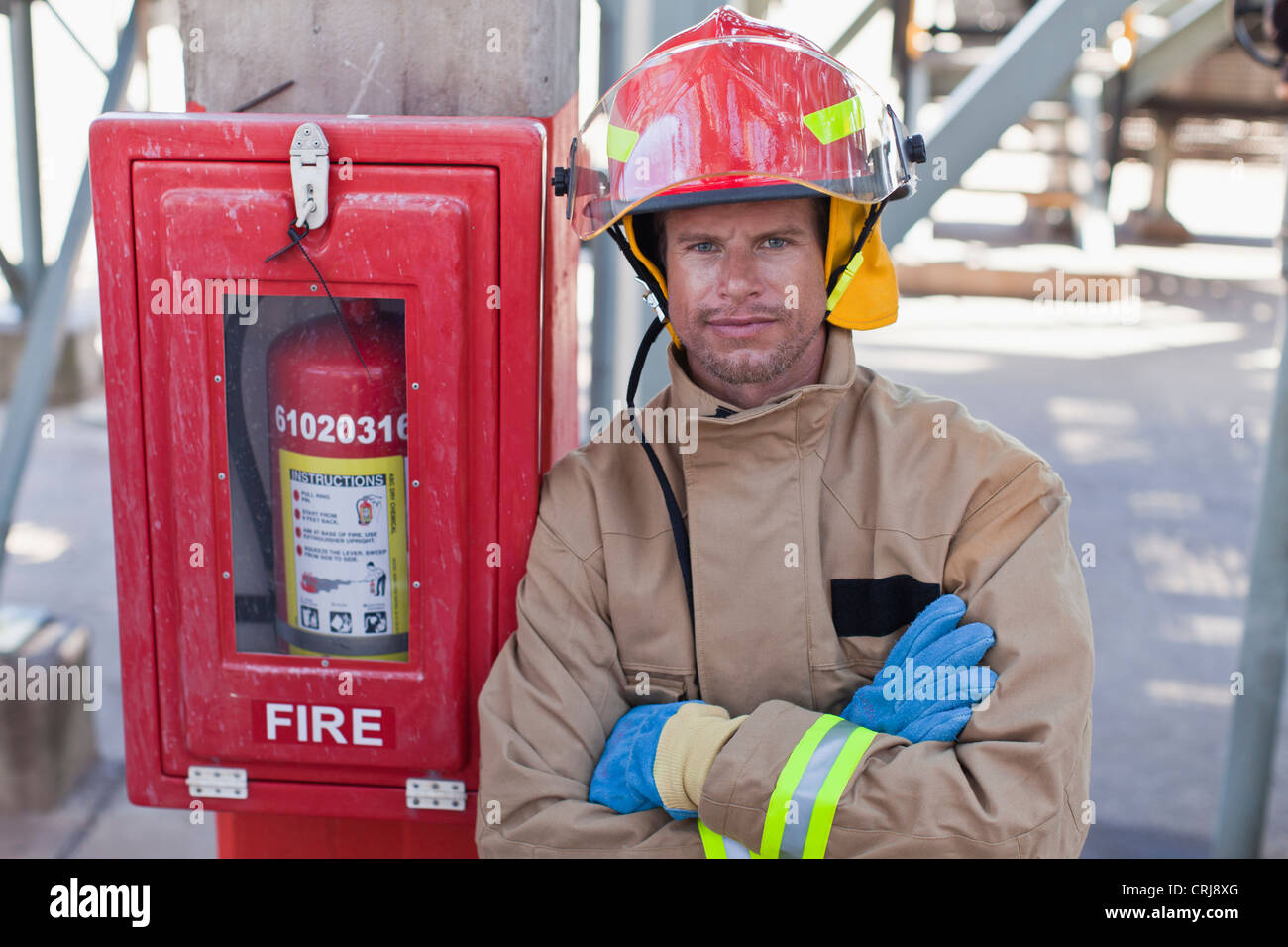 Firefighter smiling on site Stock Photo - Alamy