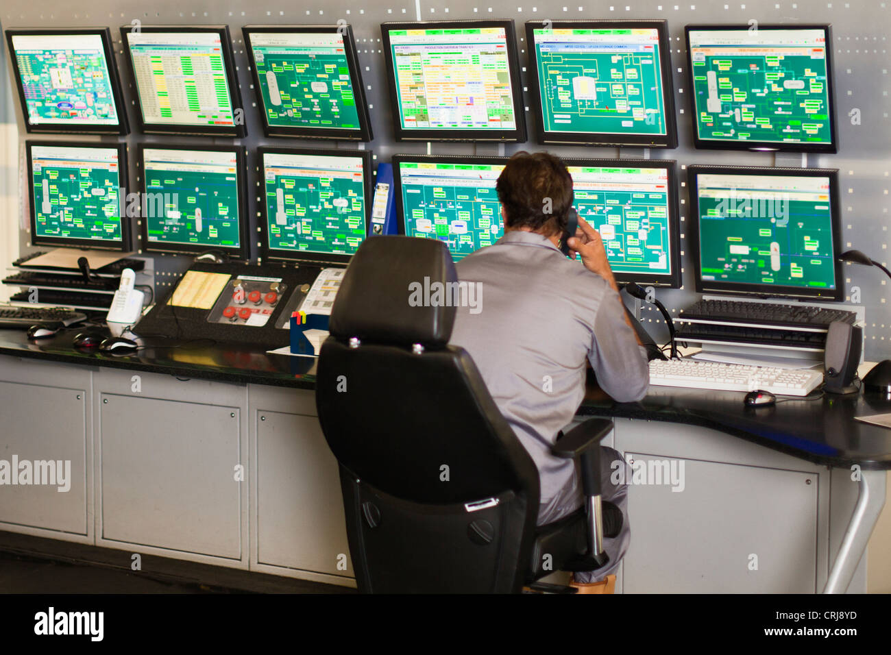 Man working in security control room Stock Photo - Alamy