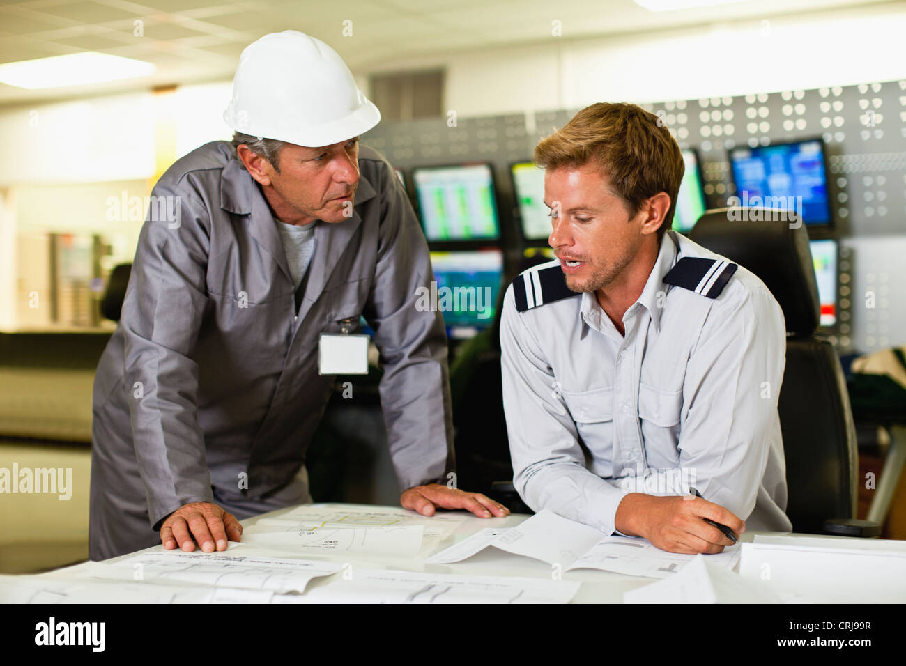 Men working in security control room Stock Photo - Alamy