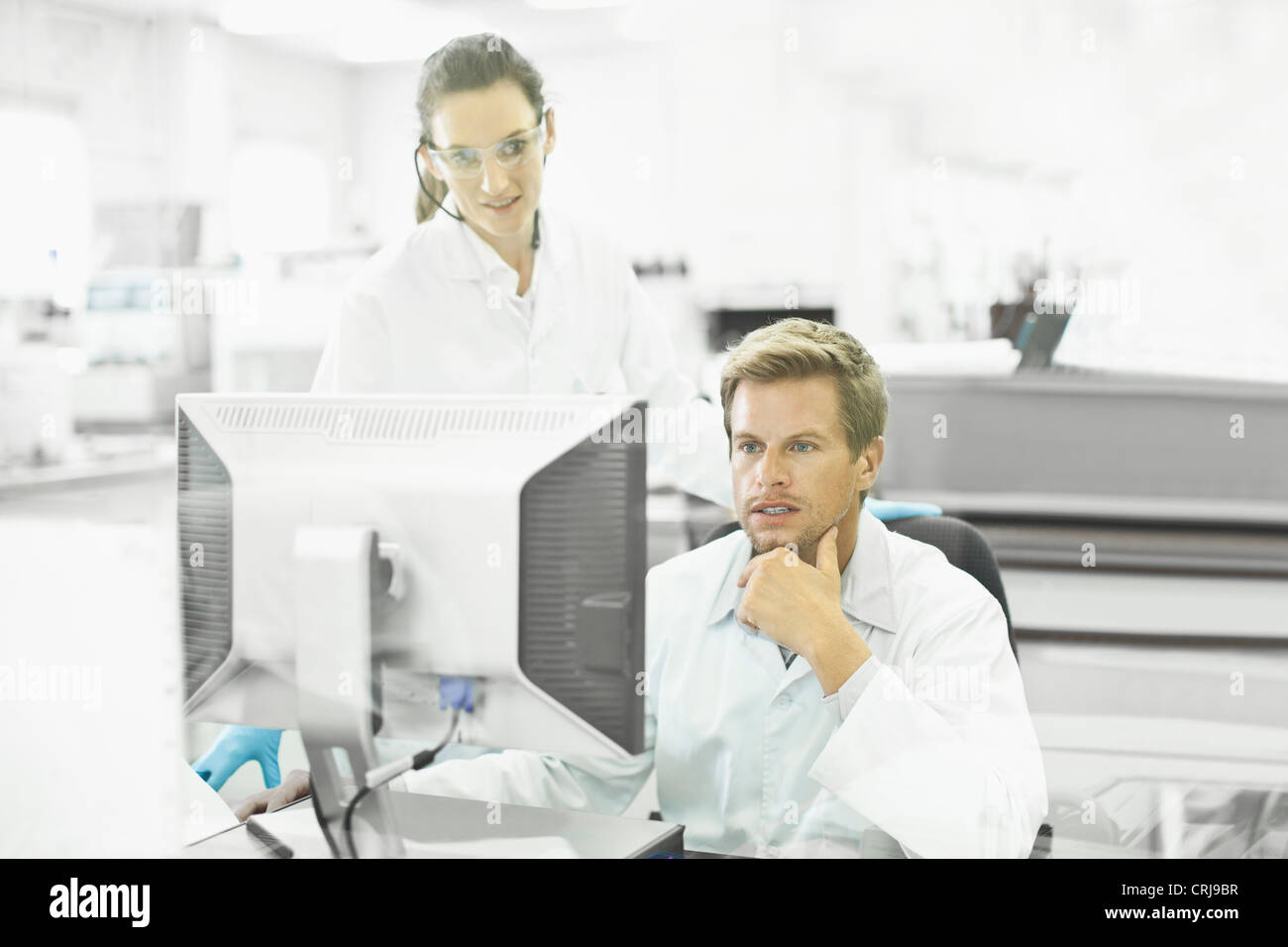 Scientists working together in lab Stock Photo - Alamy