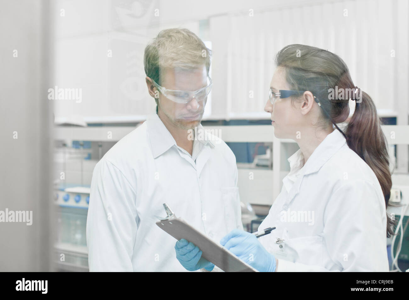 Scientists working together in lab Stock Photo - Alamy