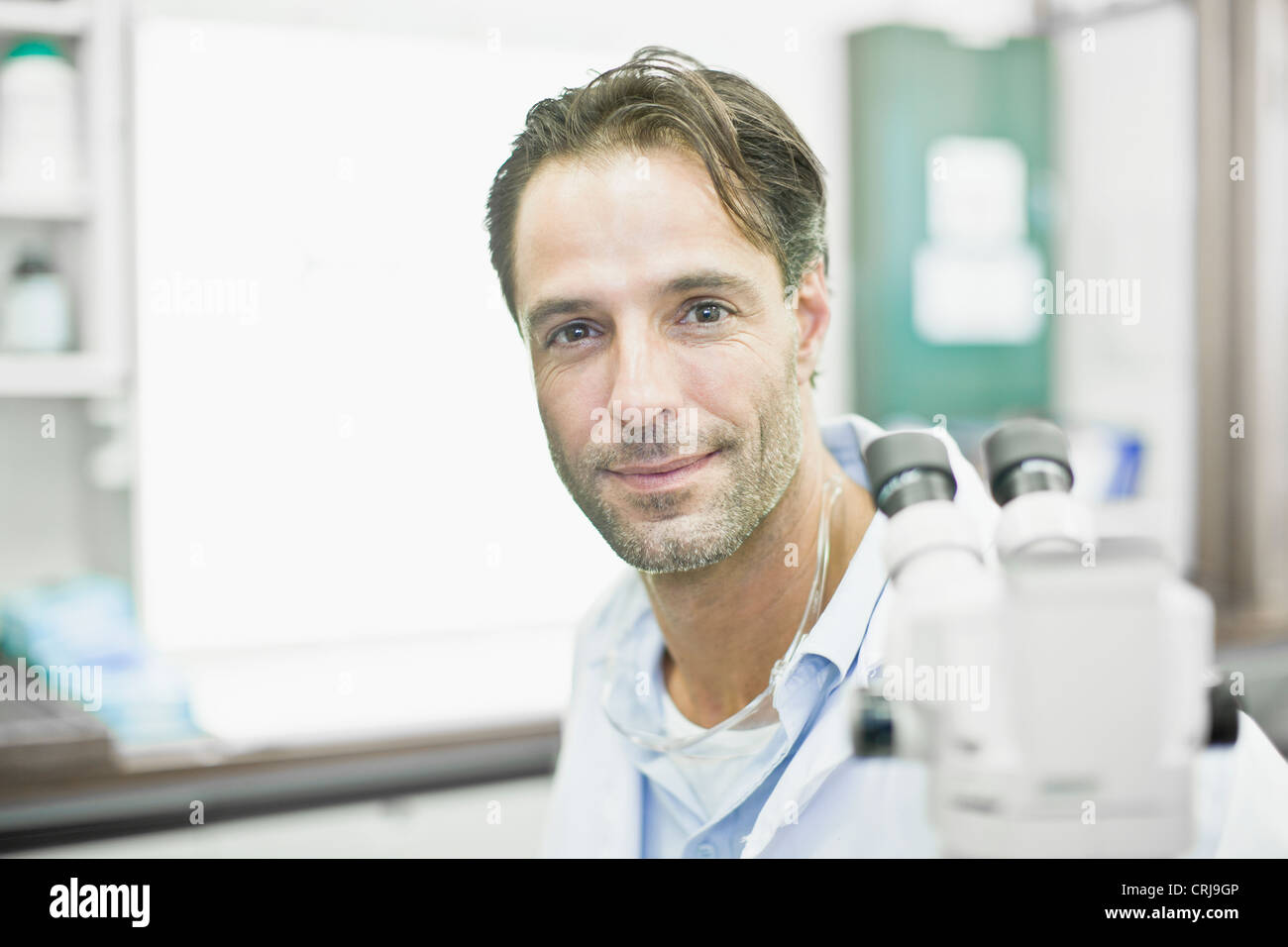 Scientist smiling in lab Stock Photo - Alamy