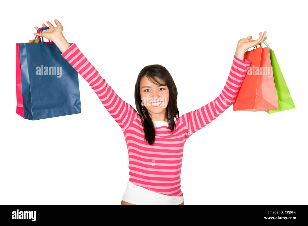 young girl holding up four shopping bags with a smile Stock Photo - Alamy