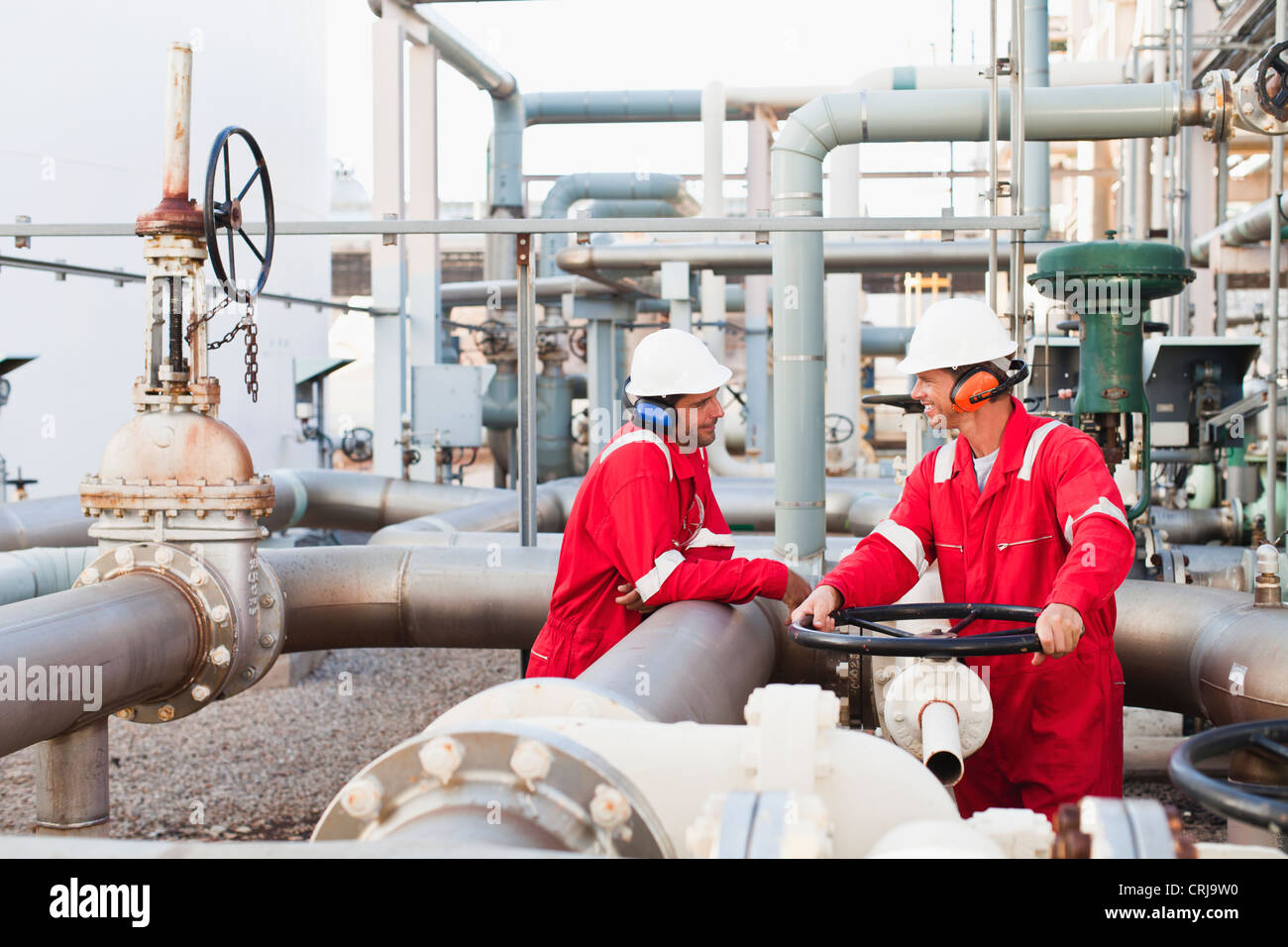 Men opening valve hi-res stock photography and images - Alamy