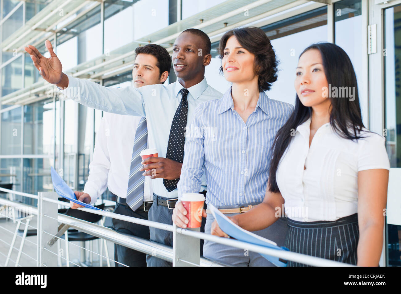 Business people on indoor balcony Stock Photo - Alamy