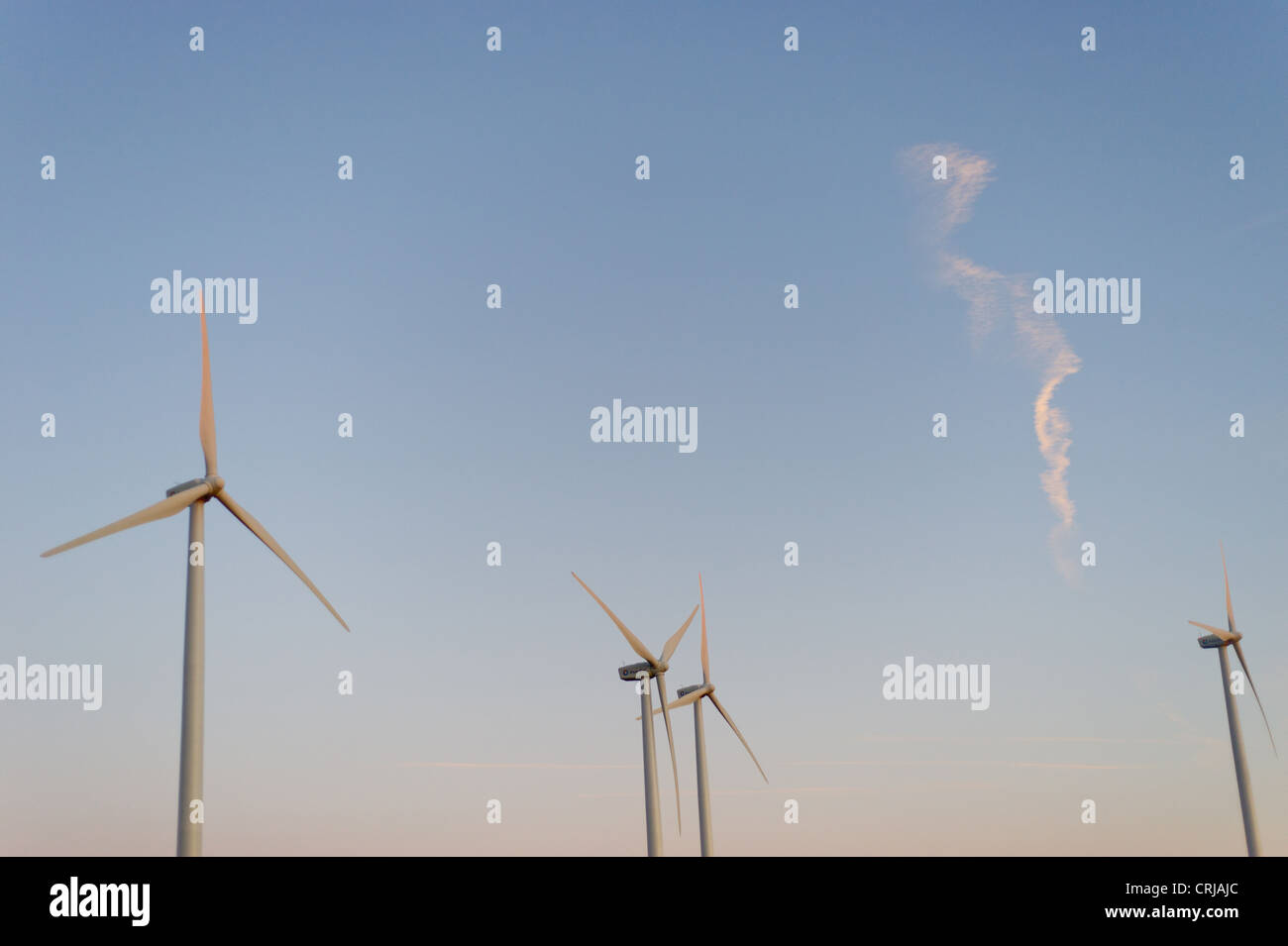 Four wind turbines and sky with cloud Stock Photo - Alamy