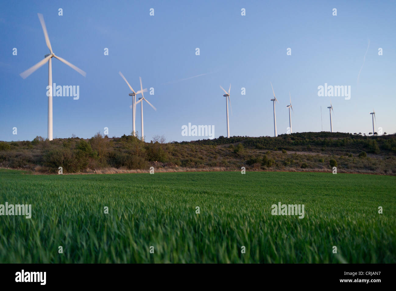 Eight wind turbines and grass fields in the mountain Stock Photo - Alamy