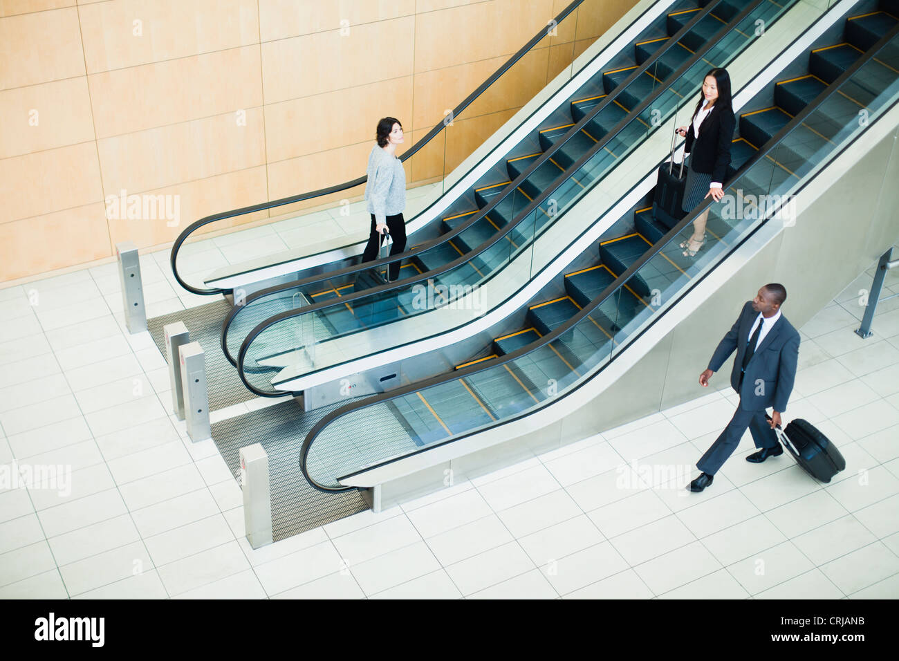 Business people in lobby area Stock Photo - Alamy