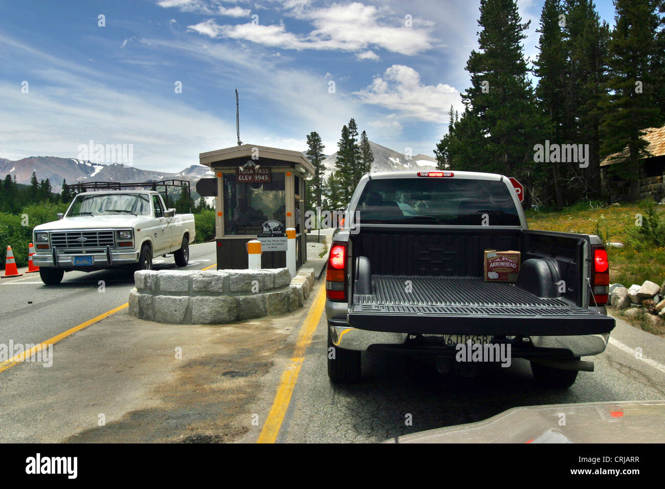 visitors' cars at the entrance to Yosemite National Park at the Tioga ...