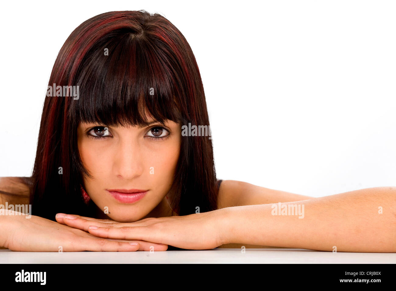 young woman leaning her chin on her arms Stock Photo - Alamy