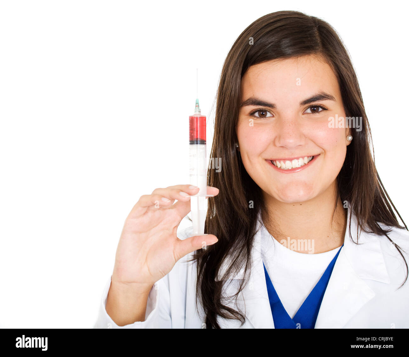 female doctor in a hospital smiling and holding a syringe on her hand ...