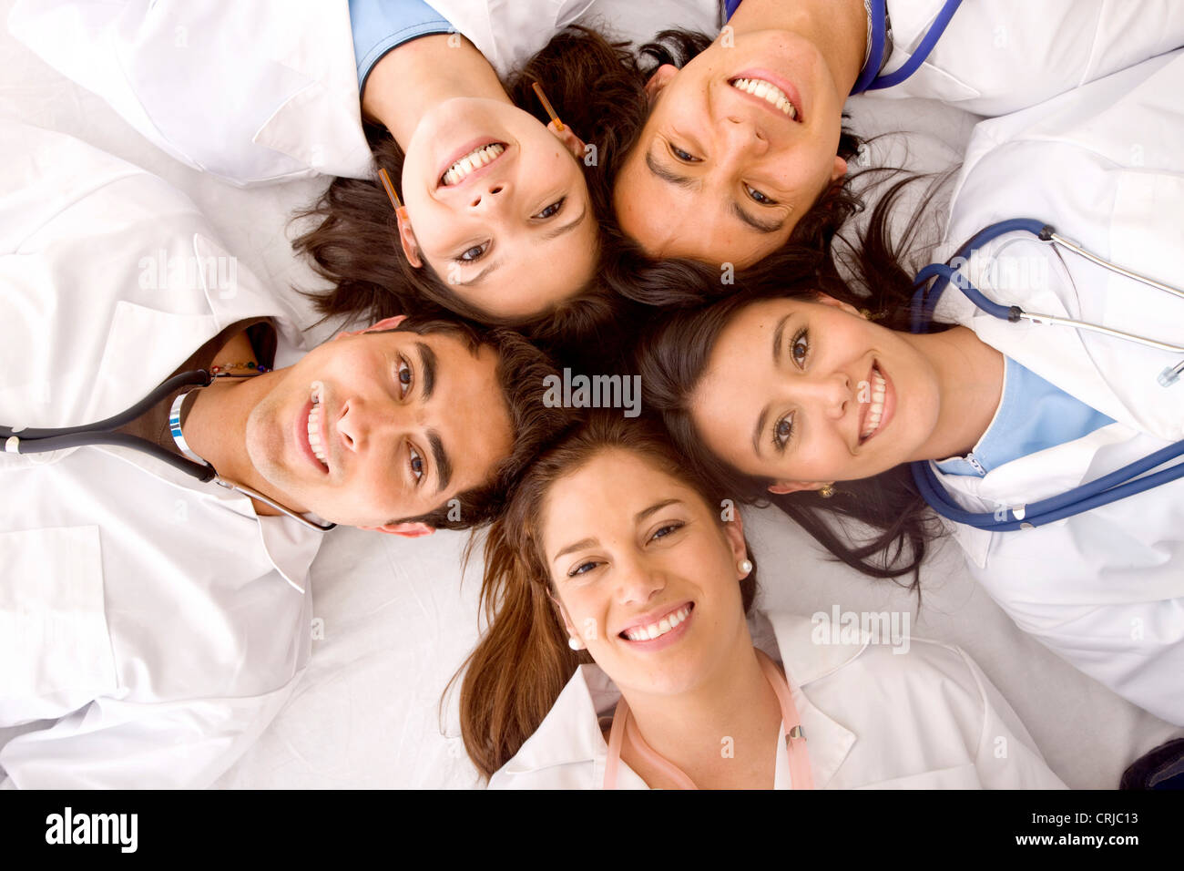 happy group of doctors smiling with their heads together Stock Photo ...