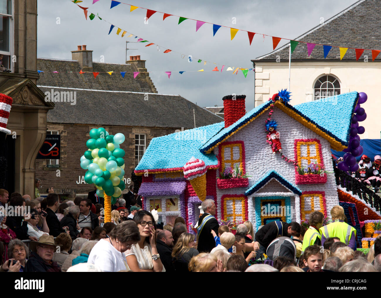 Floats or 'lorries' in the procession through the streets of Lanark on ...