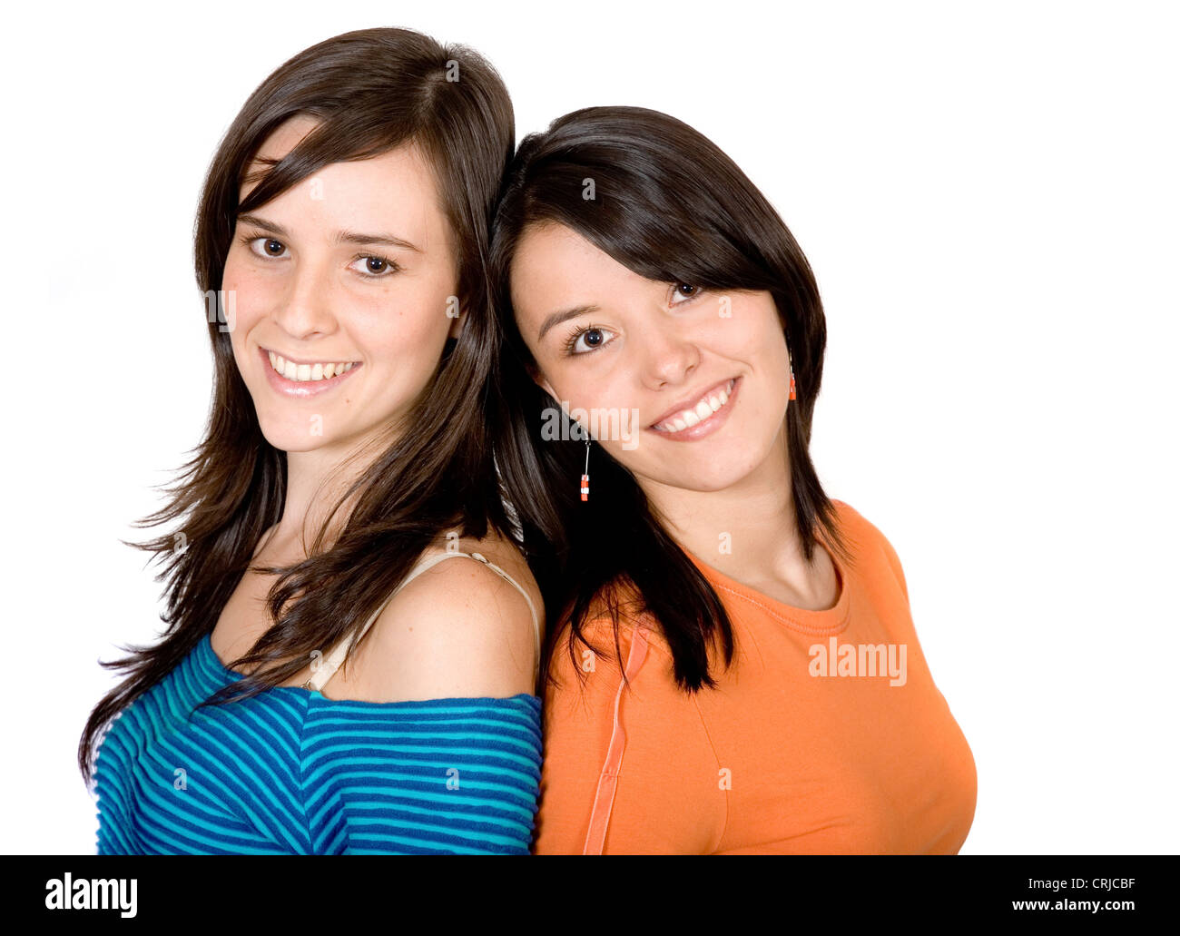 beautiful female friends back to back Stock Photo - Alamy