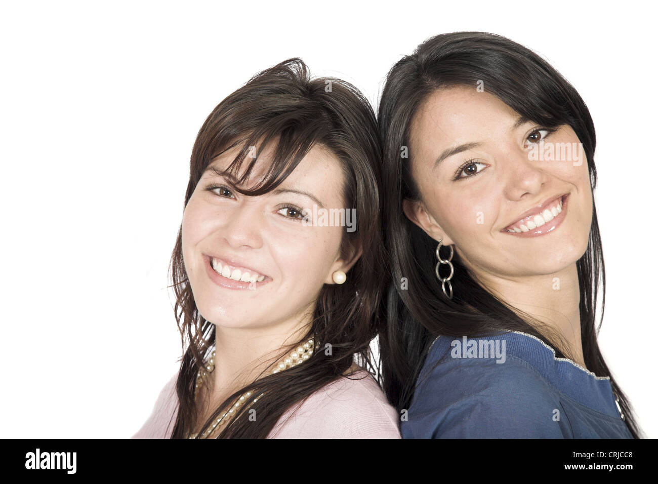 beautiful female friends back to back Stock Photo - Alamy